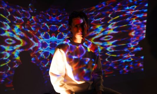 Apollo Rising envisions his burial plot in new video for 'Passenger'